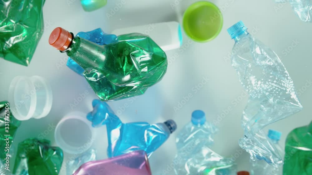 Super slow motion of plastic waste flying into the air. Filmed on high ...