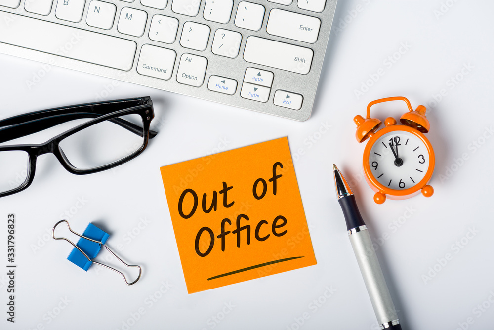 Out of office - memo on office workplace. Holiday Announcement, Day Off ...