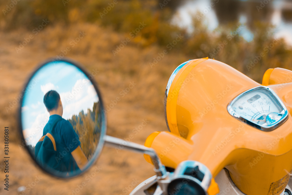 Reflection of a man in the side mirror of a motorbike Stock Photo ...
