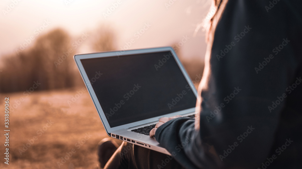 Using laptop computer in nature, technology and freedom concept Stock ...