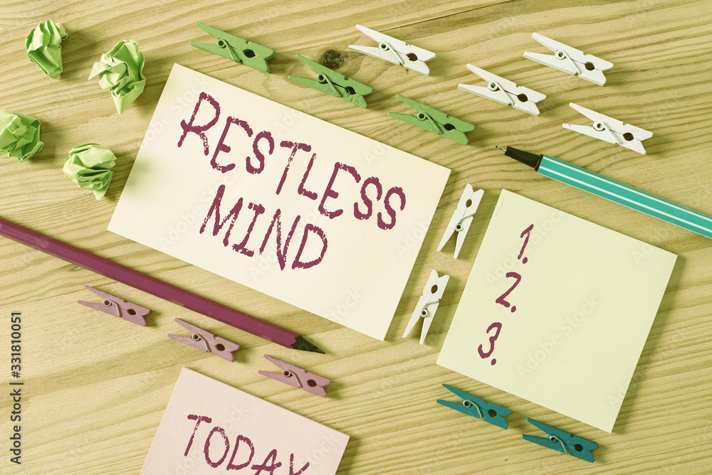 Writing note showing Restless Mind. Business concept for A ...