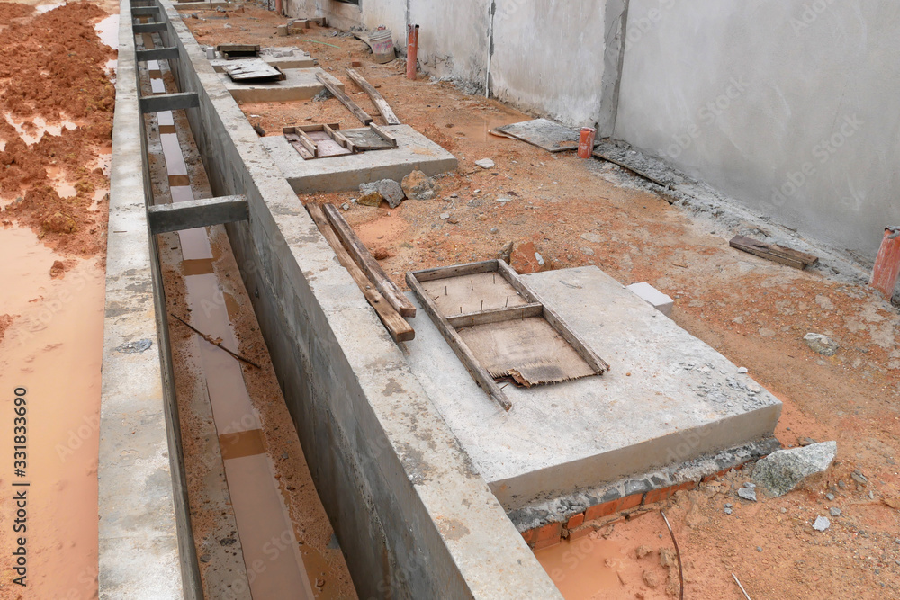 Utility services manhole under construction at the construction site ...