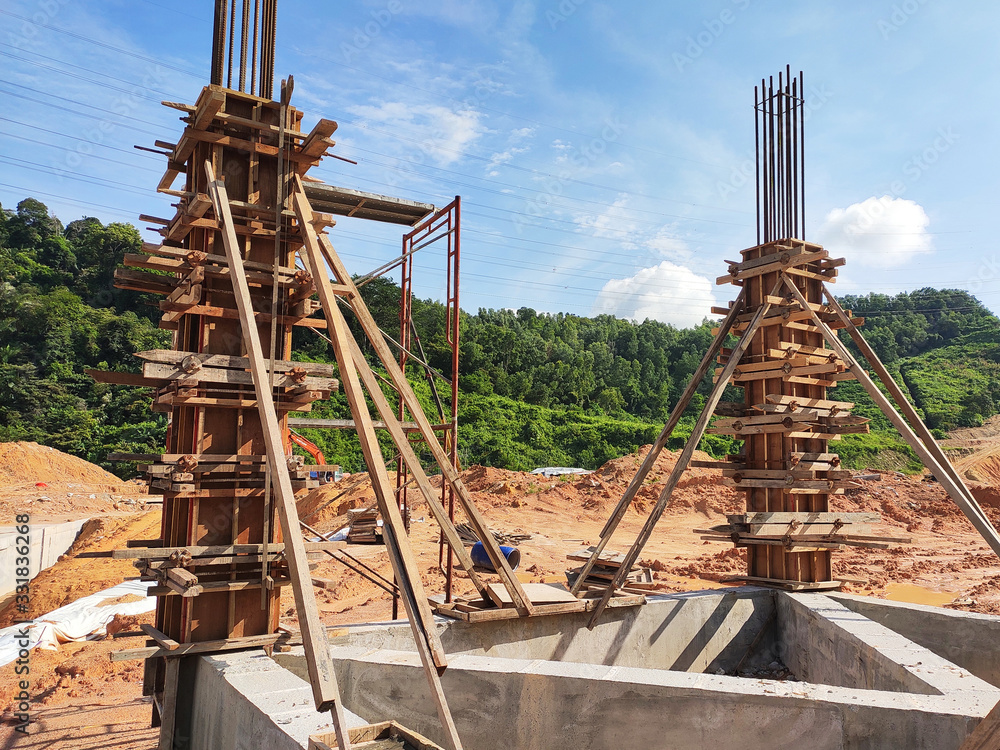 Column timber form work and reinforcement bar at the construction site ...