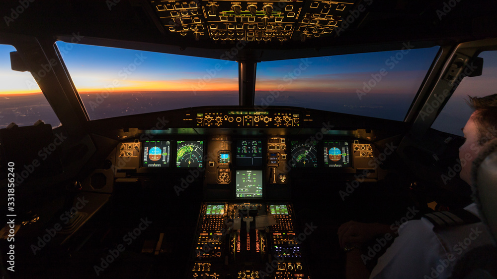 Sunset in the flightdeck of the Airbus A320 Stock Photo | Adobe Stock