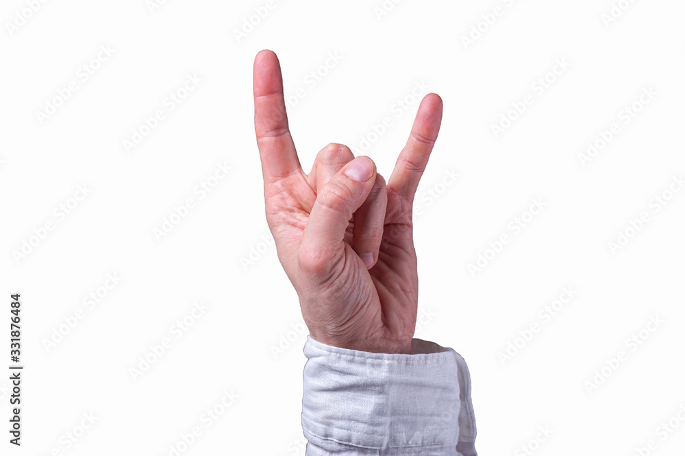 Hand of a man in a white shirt shows The sign of the horns on isolated ...