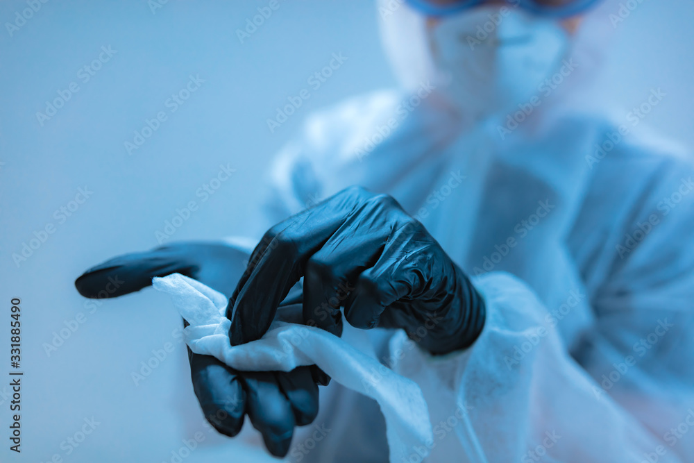 Medical doctor, scientist in full body suit for prevention from viruses ...