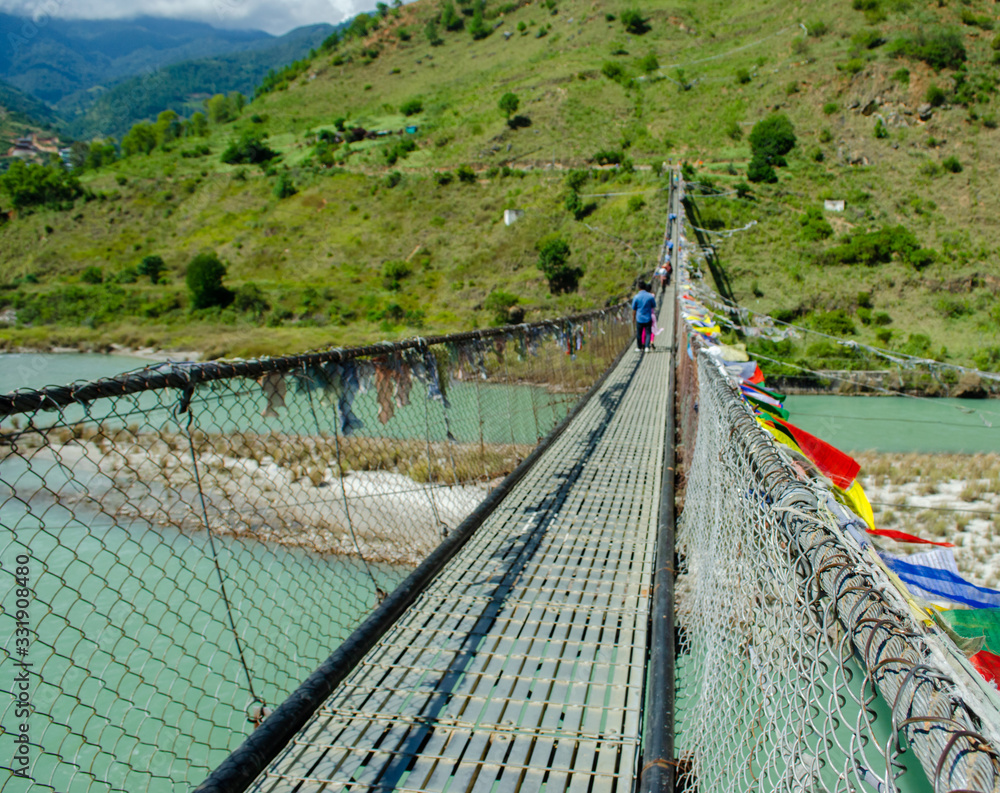 The520 feet high suspension bridge in Punakha swinging over Tsang river ...