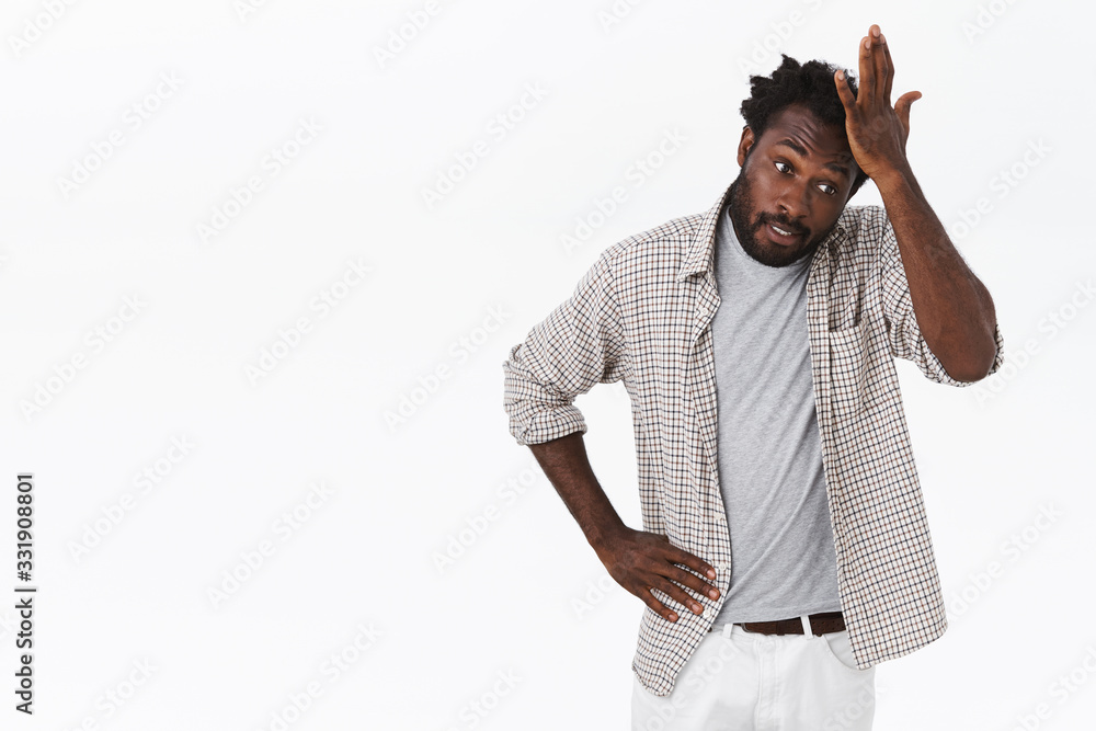 Guy punching his forehead as remember something important that slipped ...