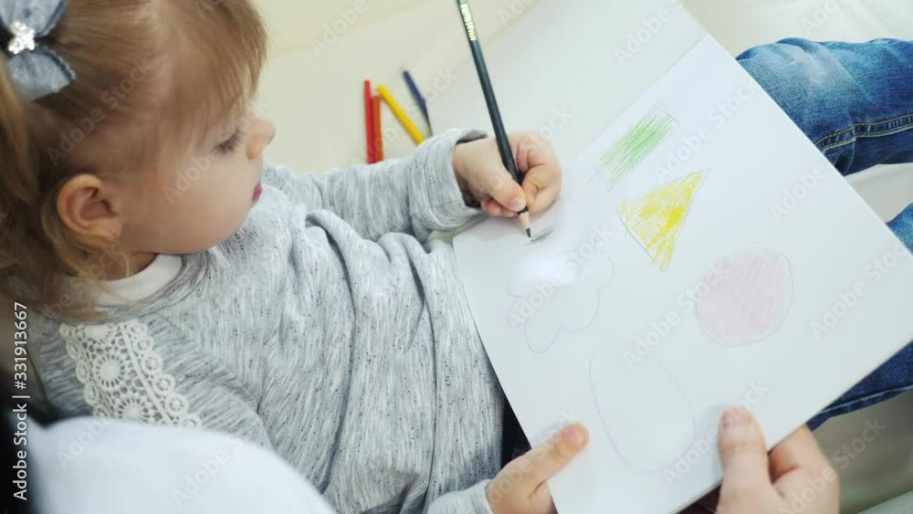little girl and mom draw teamwork happy family concept. child daughter ...