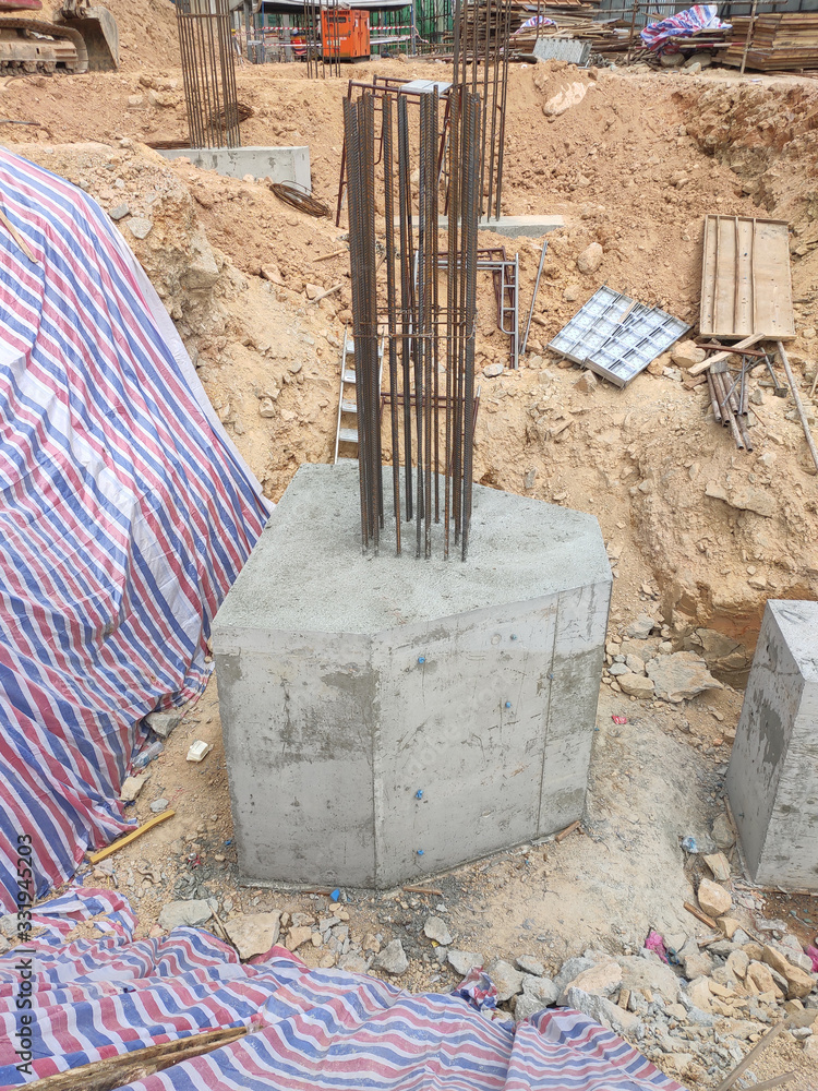Pile cap and column stump under construction at the construction site ...