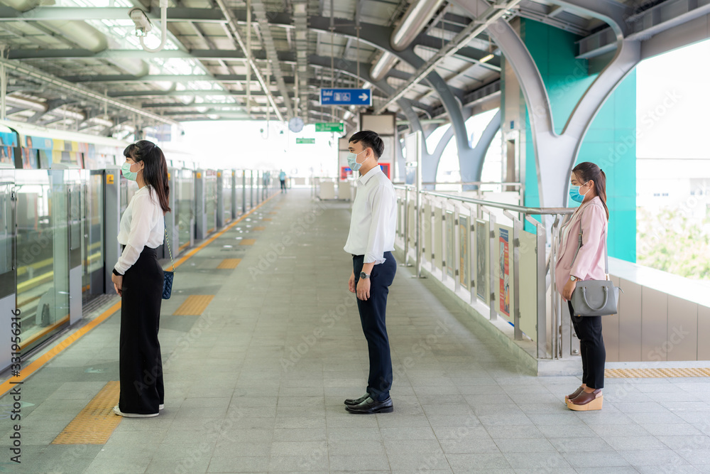 Three Asian people wearing mask standing distance of 1 meter from other ...