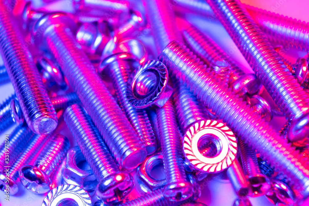 Metal bolts and nuts in a row background. Chromed screw bolts and nuts ...