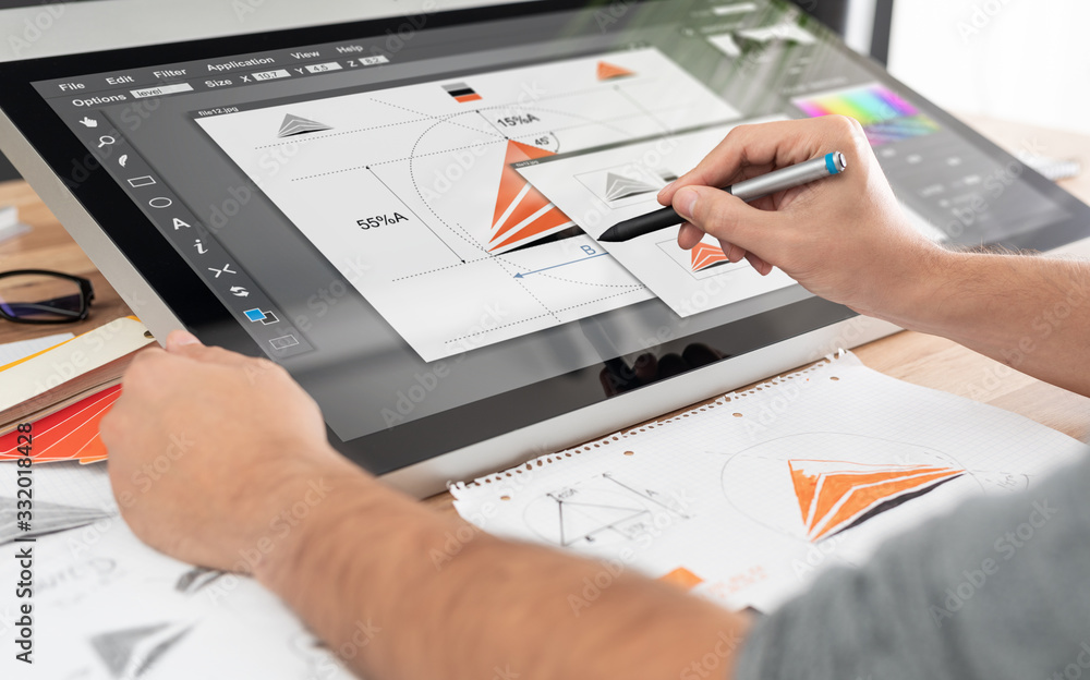 Graphic designer drawing sketches logo design. Stock Photo | Adobe Stock