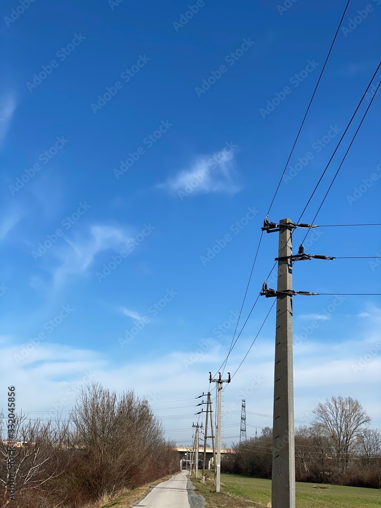 asphalt road, power line, energy pylon, high voltage, field, sky ...