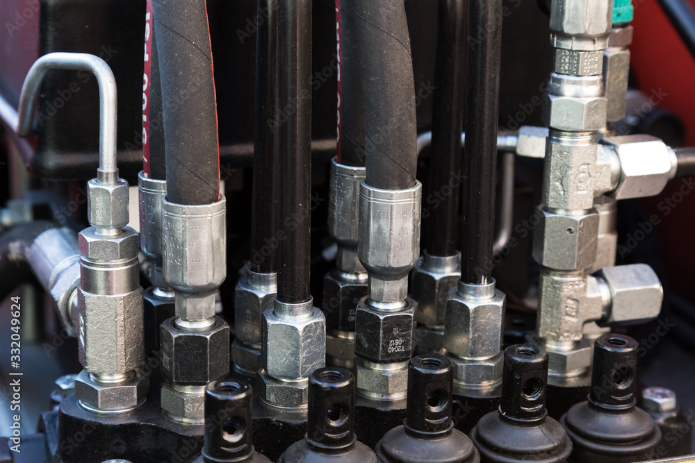 Detail of hydraulic hoses, couplings, connectors and fittings on an ...