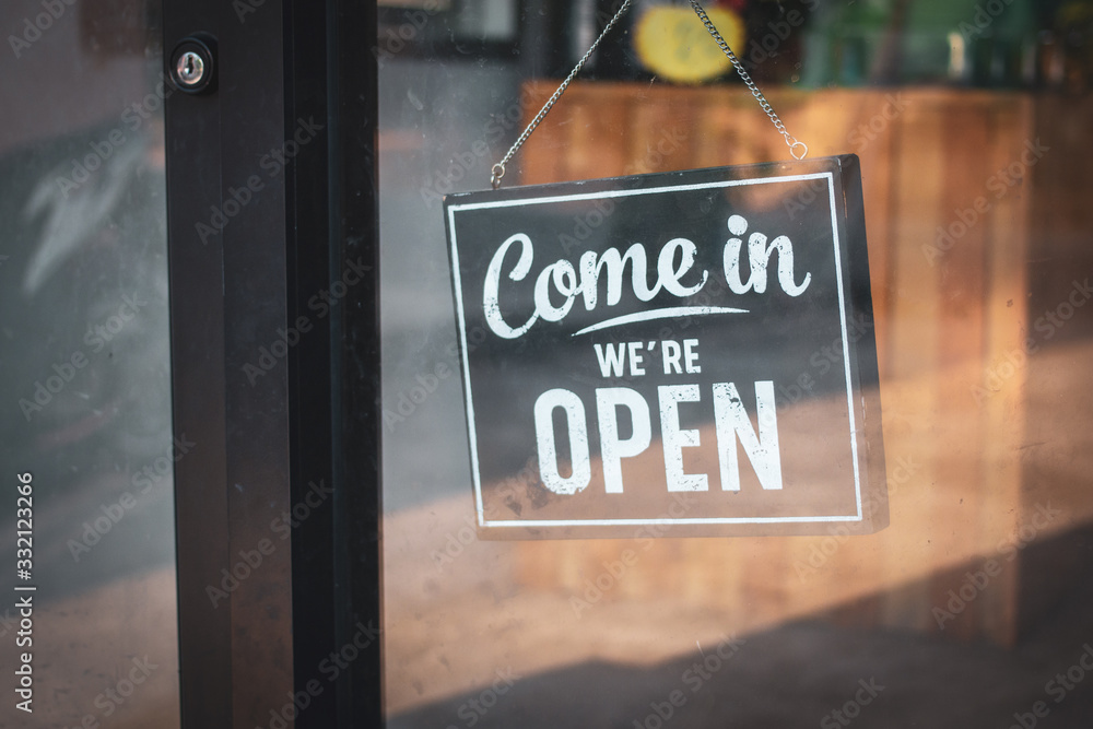 A business sign that says 'Come in We're Open'. Stock Photo | Adobe Stock