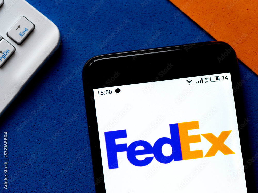In this photo illustration FedEx Corporation logo is seen displayed on ...