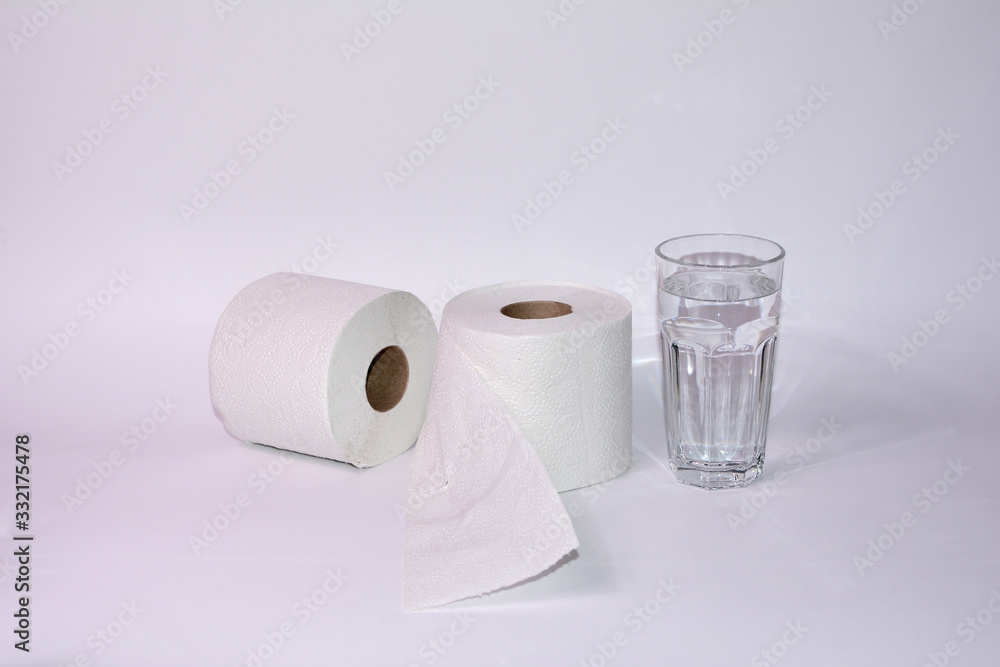 Toilet paper rolls with a glass of water Stock Photo | Adobe Stock