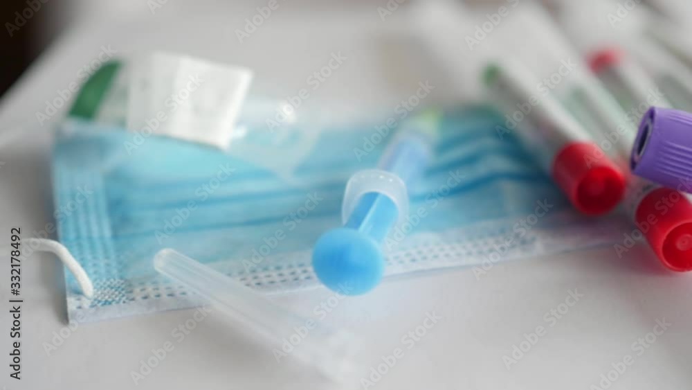 slow dolly shot, blood sample ampoule coronavirus, covid-19, positive ...