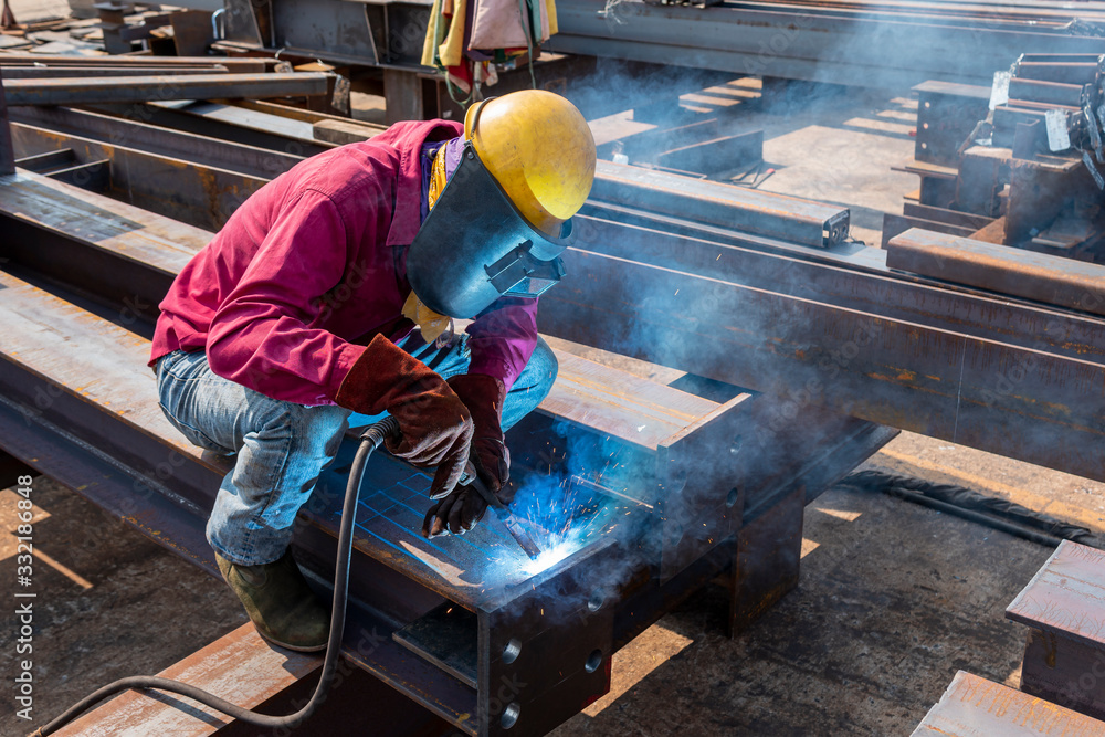 Foto de The welder is welding a steel structure work with process Flux ...
