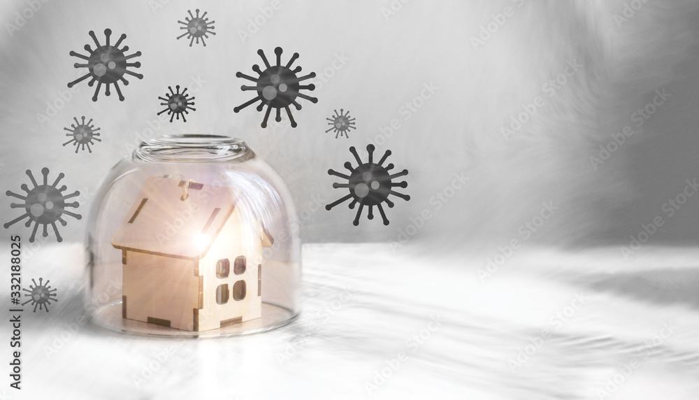 The concept of quarantine, stay at home. A small wooden house is ...