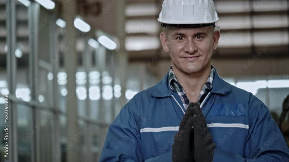 Engineer factory man greeted with hands to pay respect With a smile of ...