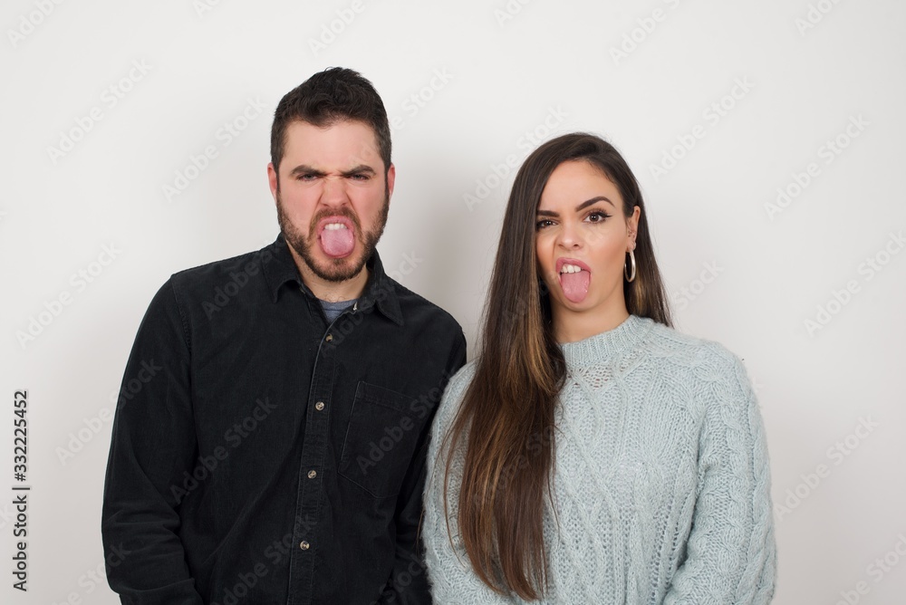 Body language. Disgusted stressed out pretty girl posing against gray ...