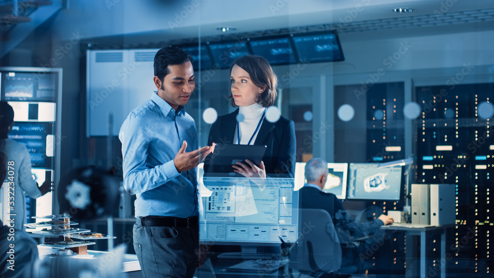 In Technology Research Facility: Female Project Manager Talks With ...