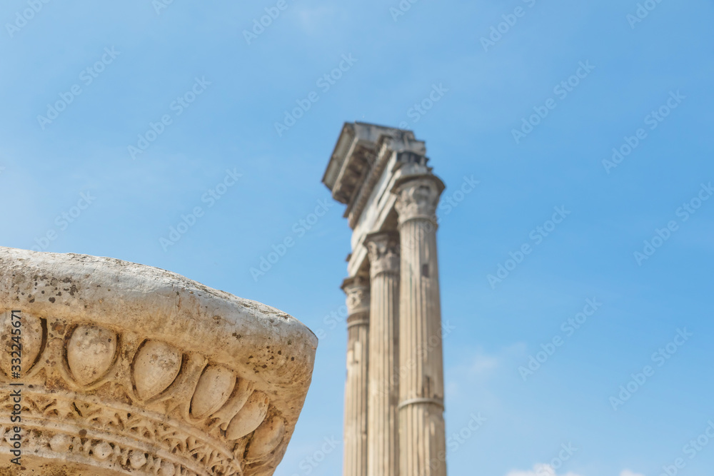 Pillar ruins and the iconic three columns in Forum Romanum. Rome. Italy ...