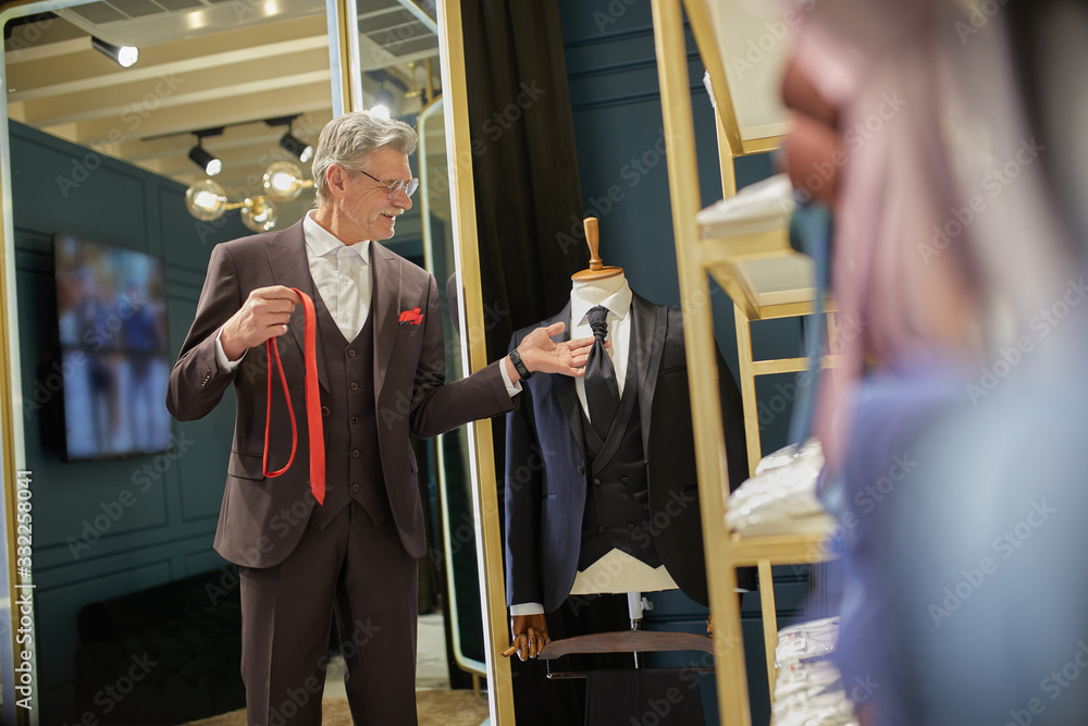 Portrait of a gorgeous millionaire or rich mature man visiting a luxury ...