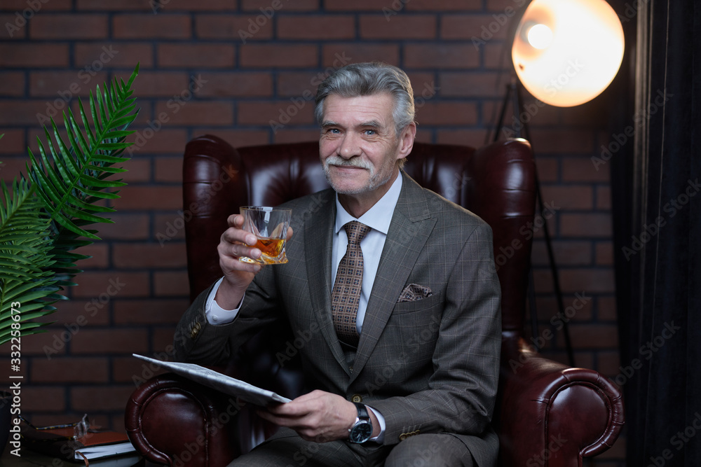 Portrait of successful millionaire and mature handsome old man sitting ...