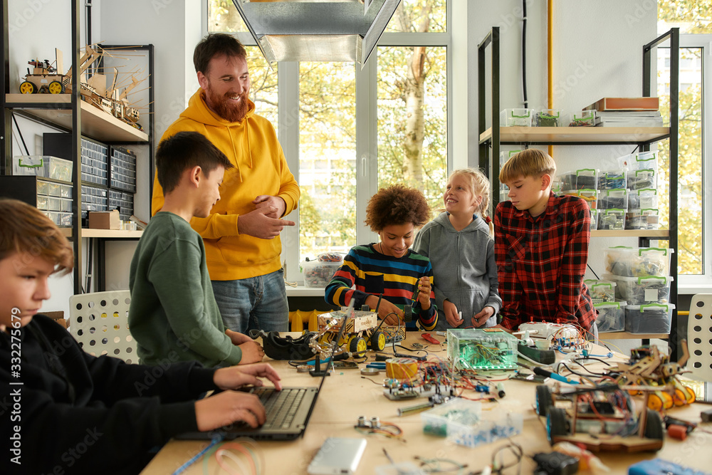 Foto de People Making Technology Work. Young technicians building a ...