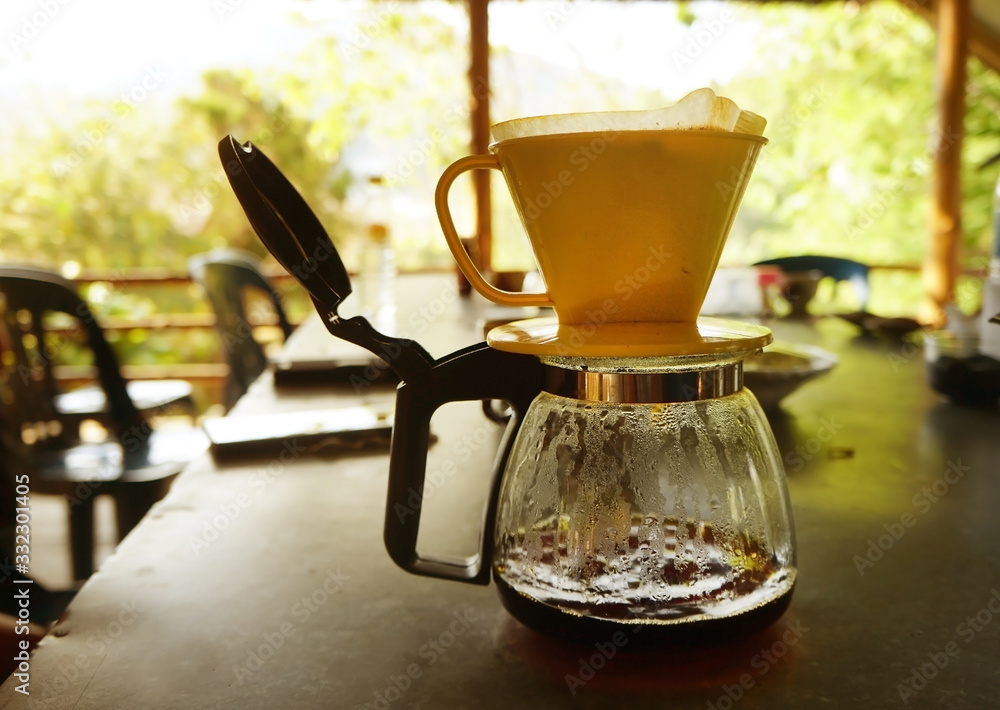 Drip brew coffee on the table. Beaker of dripping hot fresh coffee on ...