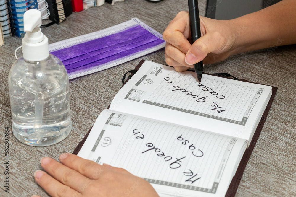 Scene of woman writes in a personal organizer about her coronavirus ...