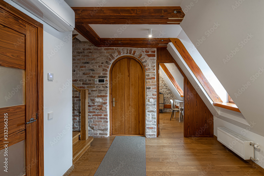Wooden loft contemporary interior of private house. Entrance door ...
