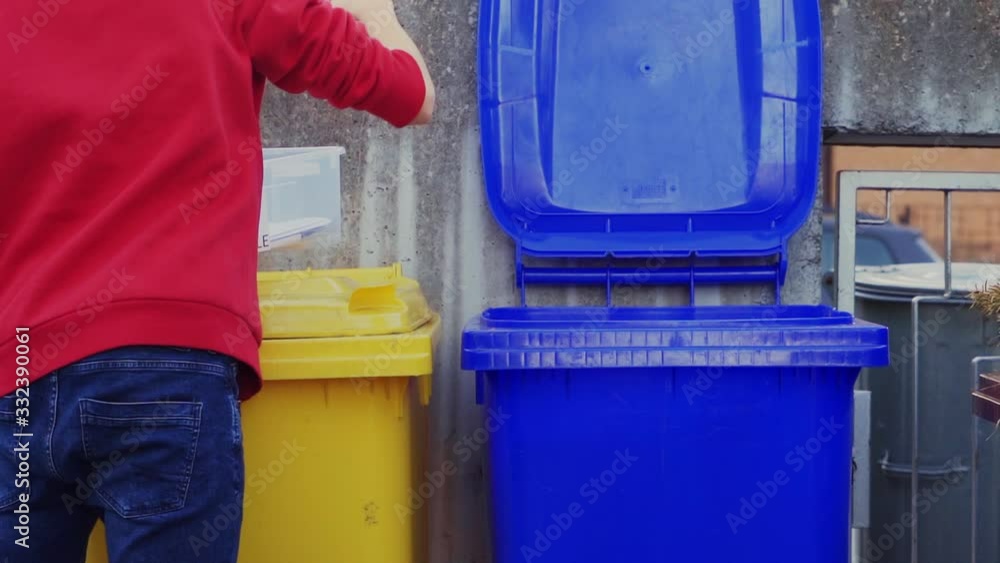 Slow motion of Young Man Sorting Used Plastic Bottles and Paper from ...
