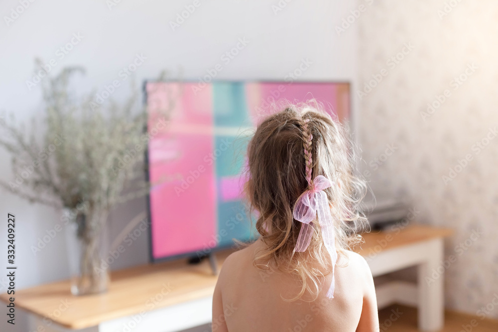 Kid watching television. Cute little girl enjoying cartoons. Bored ...
