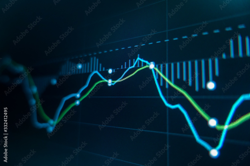 Stock market trading graph and candlestick chart on screen monitor for ...