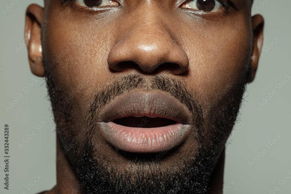 Shocked, wondered. Close up of face of beautiful african-american young ...
