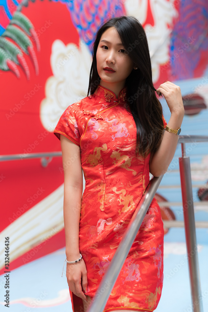 Chinese woman wearing traditional Chinese dress posing in Chinese new ...
