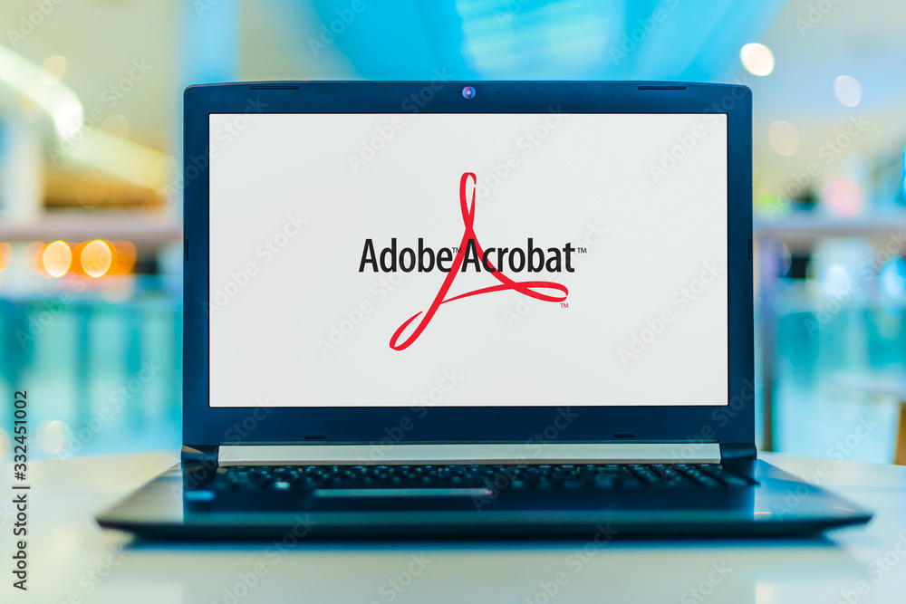 Laptop computer displaying logo of Adobe Acrobat Stock Photo | Adobe Stock
