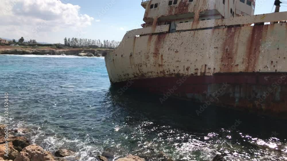 The sea waves beat against the abandoned merchant ship in the Cyprus ...