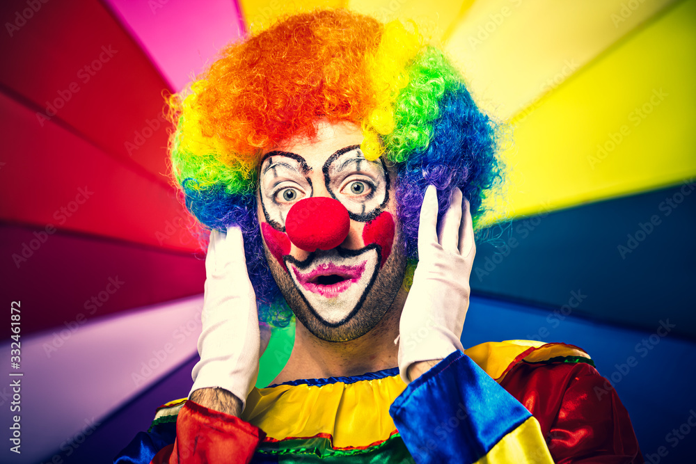 Funny clown holding his head Stock Photo | Adobe Stock