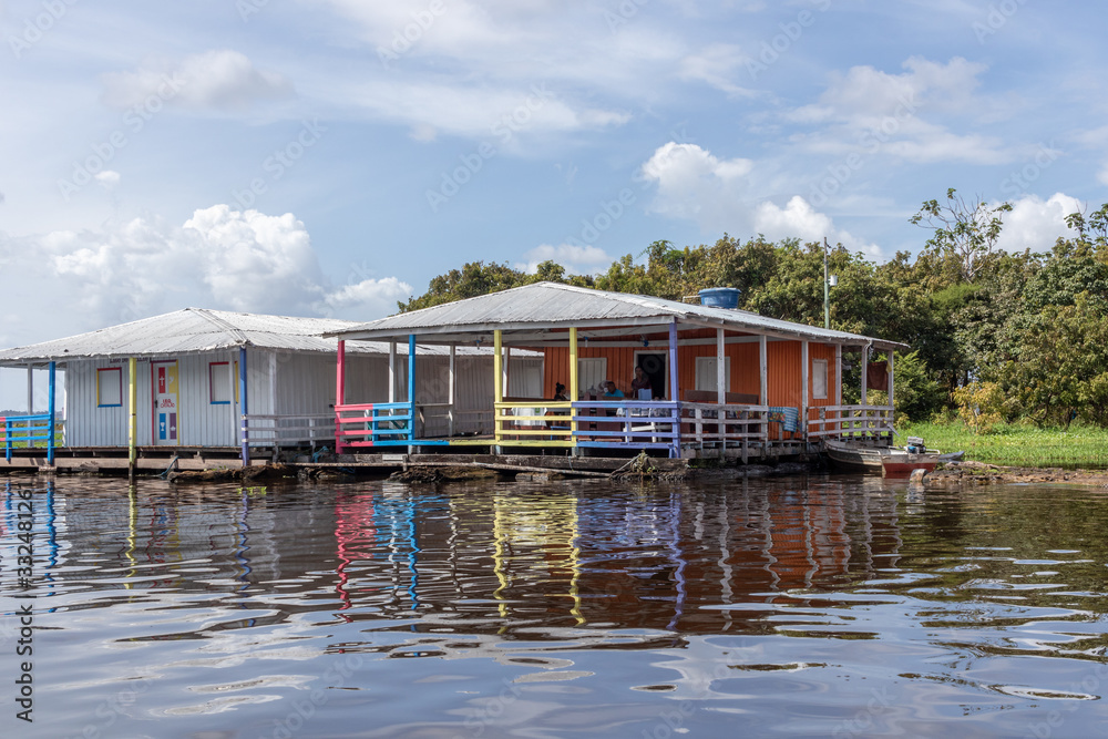 floating house in the amazon river Stock Photo | Adobe Stock