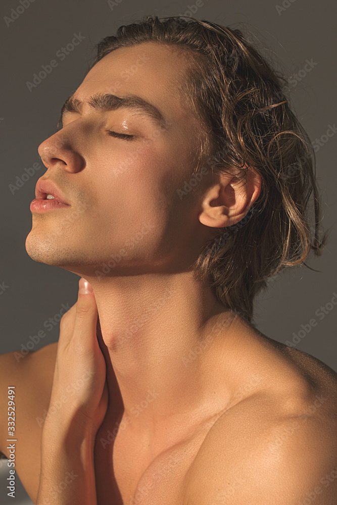 Muscle strong face beautiful stripped male model portrait in denim blue ...