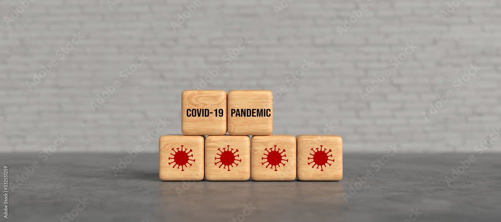 cubes with message COVID-19 and virus symbols in front of brick wall ...