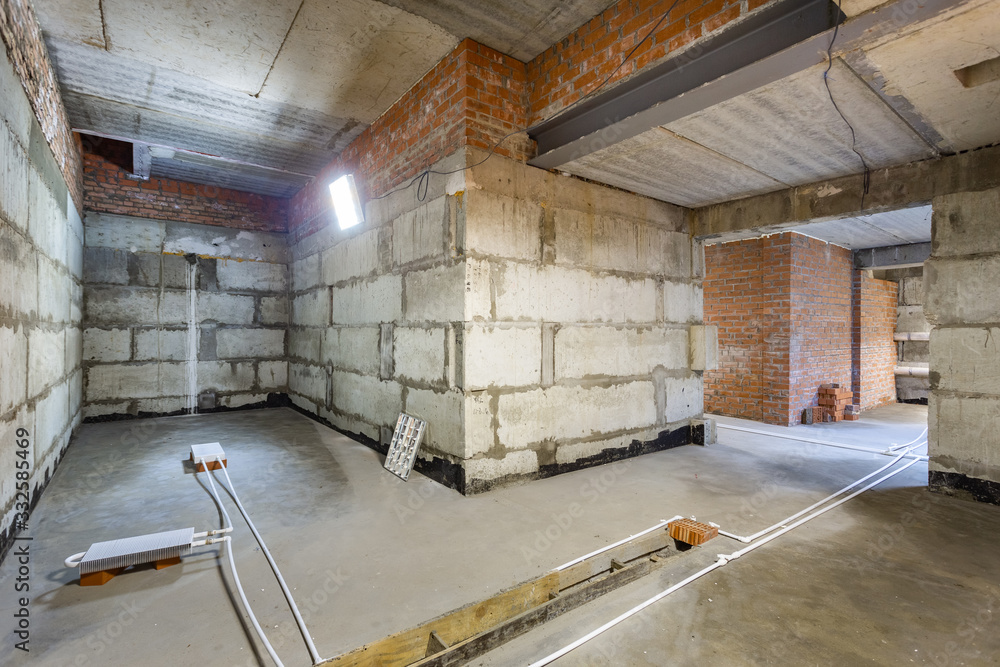 Concrete construction of basement of large building. Ground floor ...