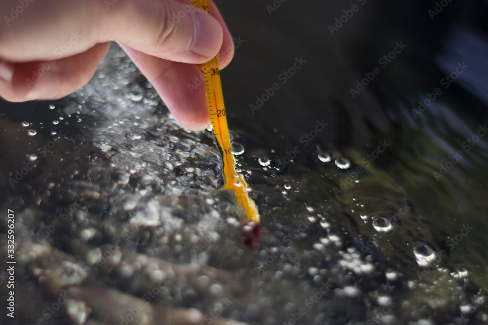 measuring water temperature with gauge ภาพถ่ายสต็อก | Adobe Stock
