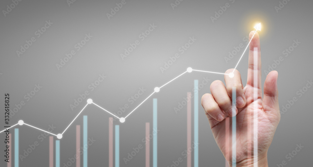 Hand touching graphs of financial indicator and accounting market ...