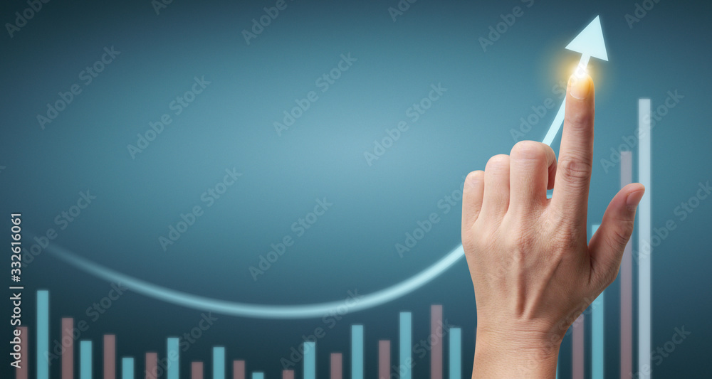 Hand touching graphs of financial indicator and accounting market ...